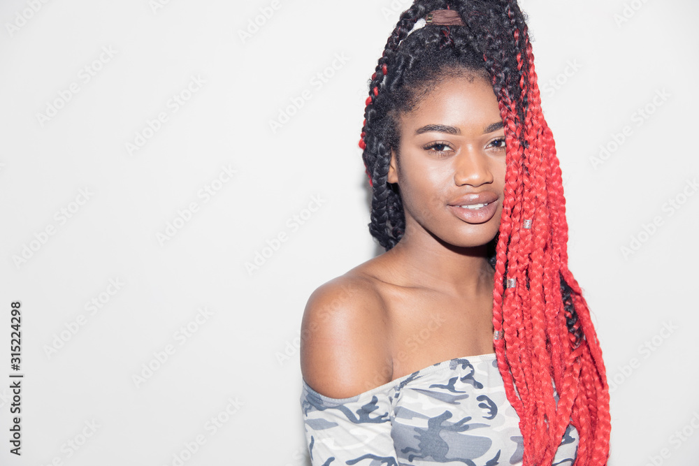 Portrait confident young woman with long, red braids Stock Photo ...