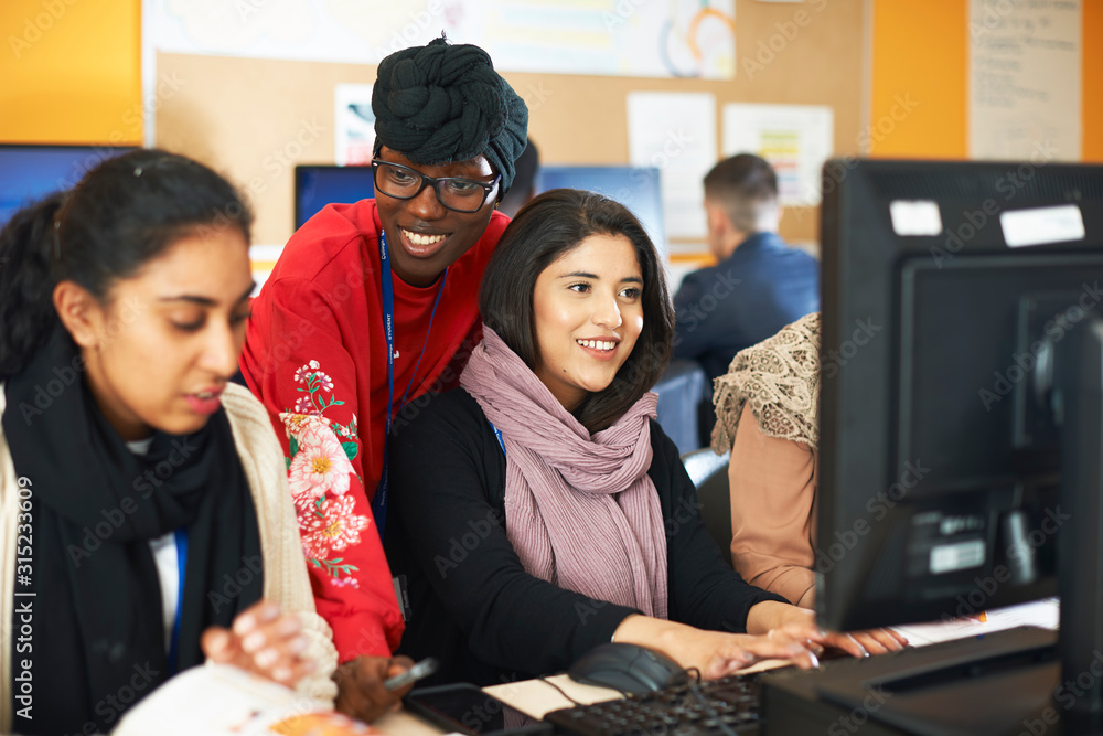 Female college students using computers in computer lab Stock Photo ...