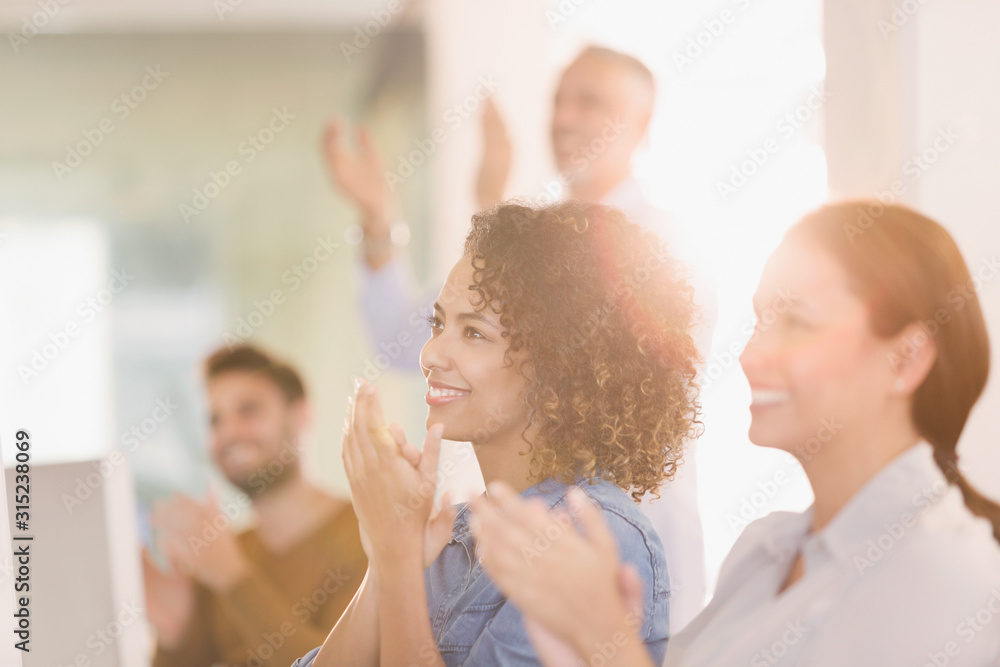 Businesswomen clapping in office Stock Photo | Adobe Stock