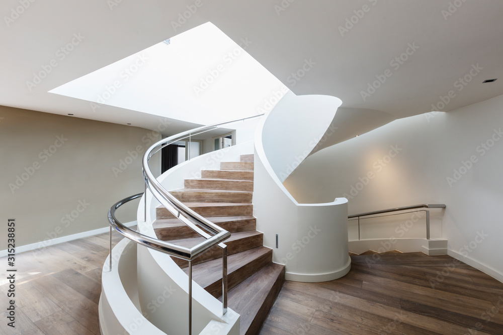 Wood spiral staircase in modern luxury home showcase interior Stock ...