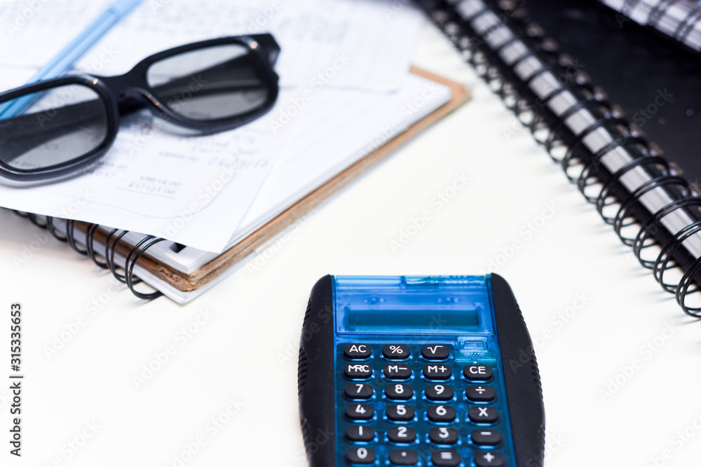 Calculating tax return numbers and figures on office desk concept for ...