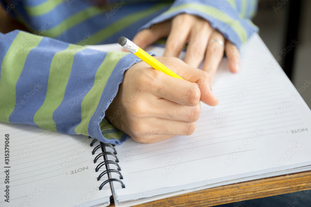 high school,university student study.hands holding pencil writing paper ...