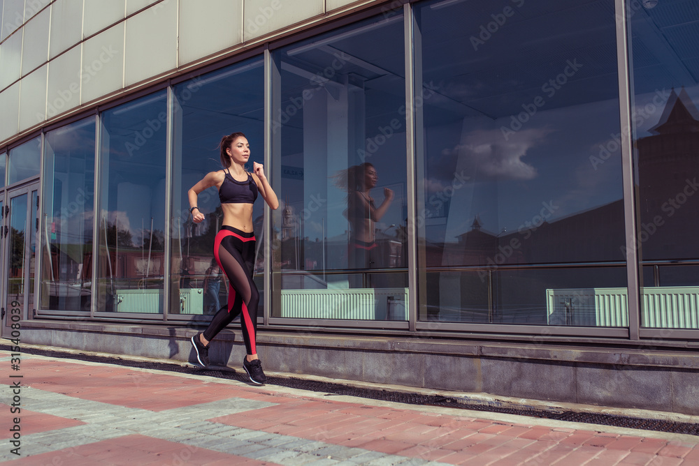 Beautiful girl runs summer city, jogging morning afternoon, fitness ...