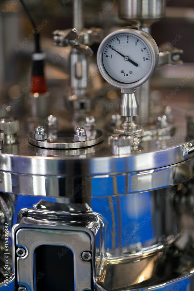 pharmaceutical reactor with analog pressure gauge Stock Photo | Adobe Stock