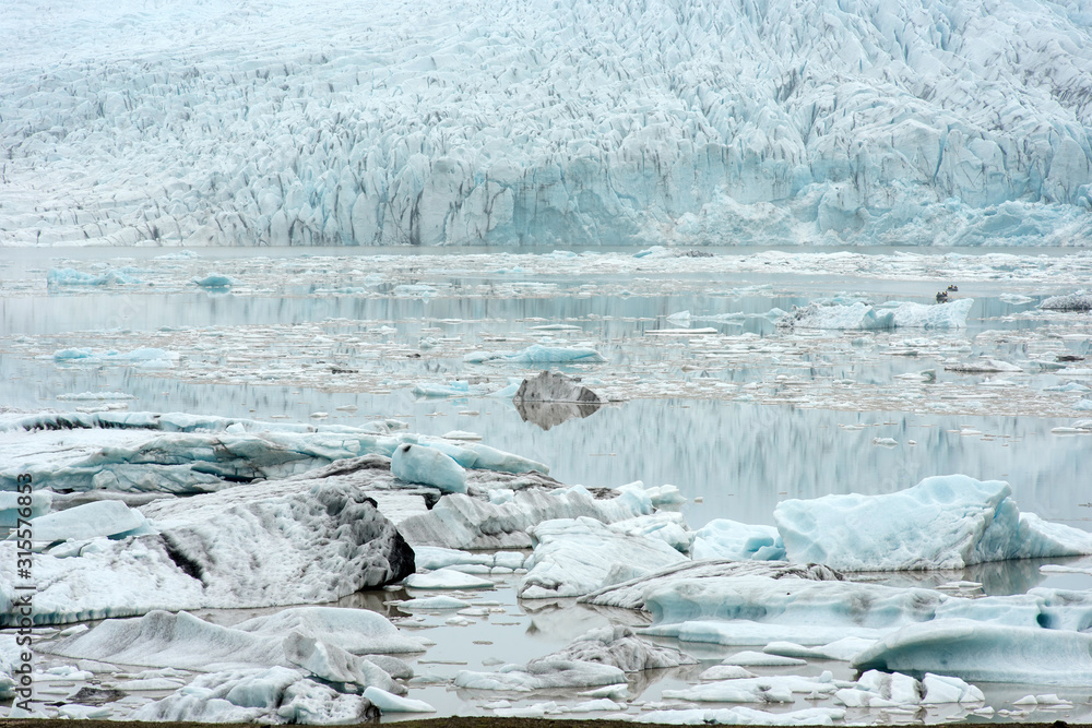 Floating icebergs melting in Fjallsarlon glacier lake, Iceland Stock ...