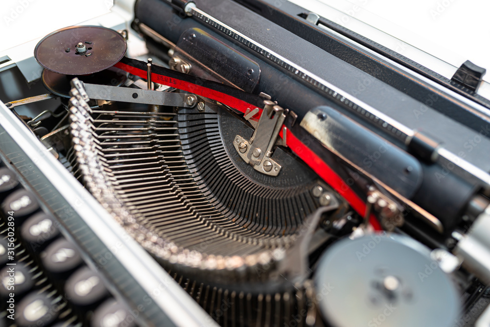Classic, manual typewriter in white with a German keyboard layout ...