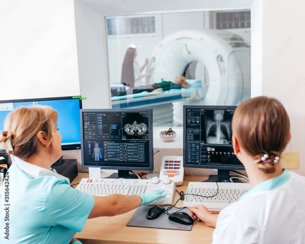 Nurse preparing patient for CT scan test in lab Stock Photo | Adobe Stock