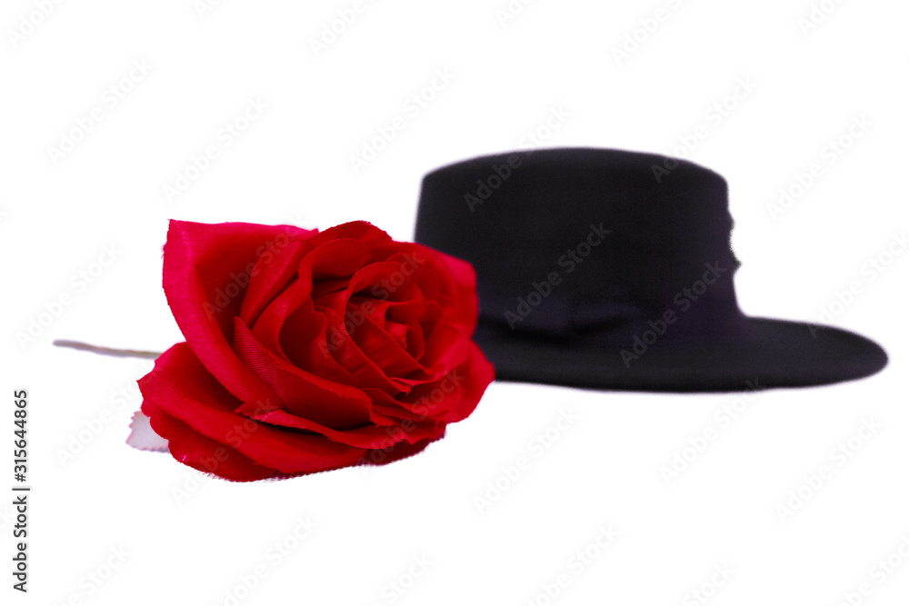 Bright red rose with a side black hat Isolated on white background ...