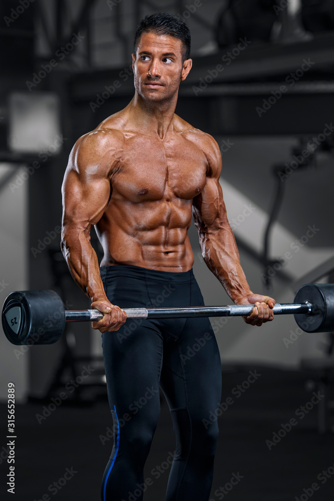 Muscular Men, Bodybuilder Lifting Weights in the Gym Stock Photo ...