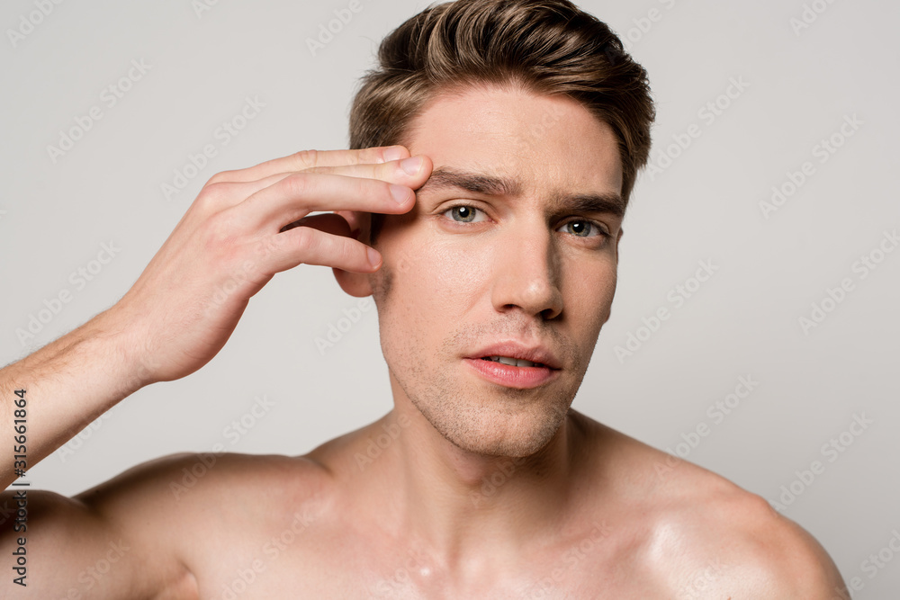 sexy man with muscular torso touching face isolated on grey Stock Photo ...