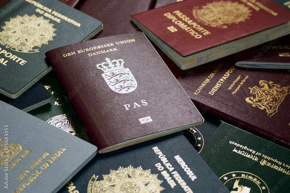 Various passports of the world with a passport of Denmark in the center ...
