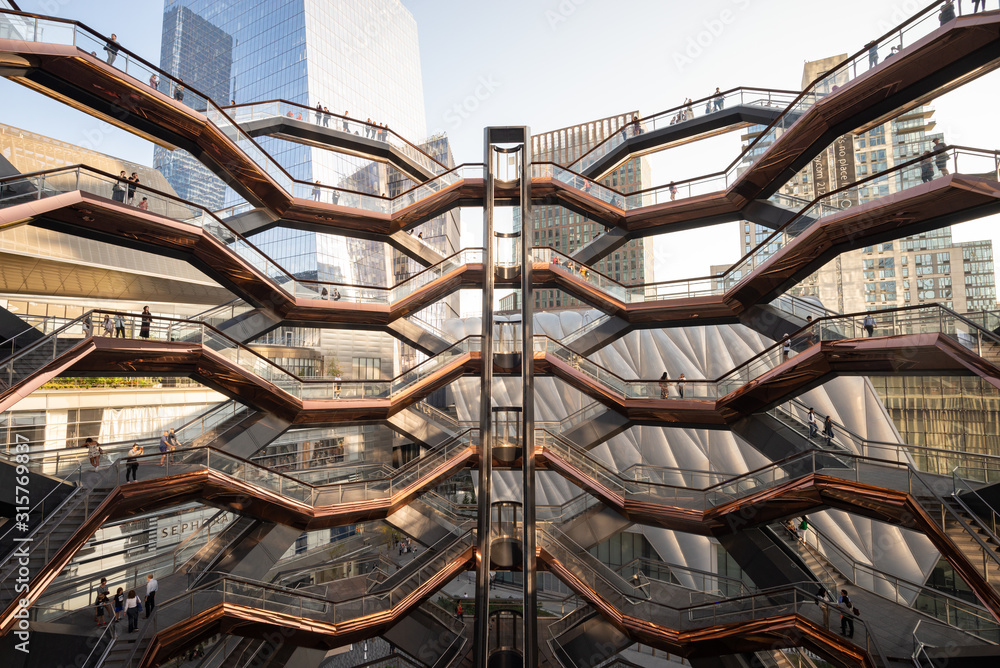 Honeycomb-like structure and elevator within The Vessel in Hudson Yards ...