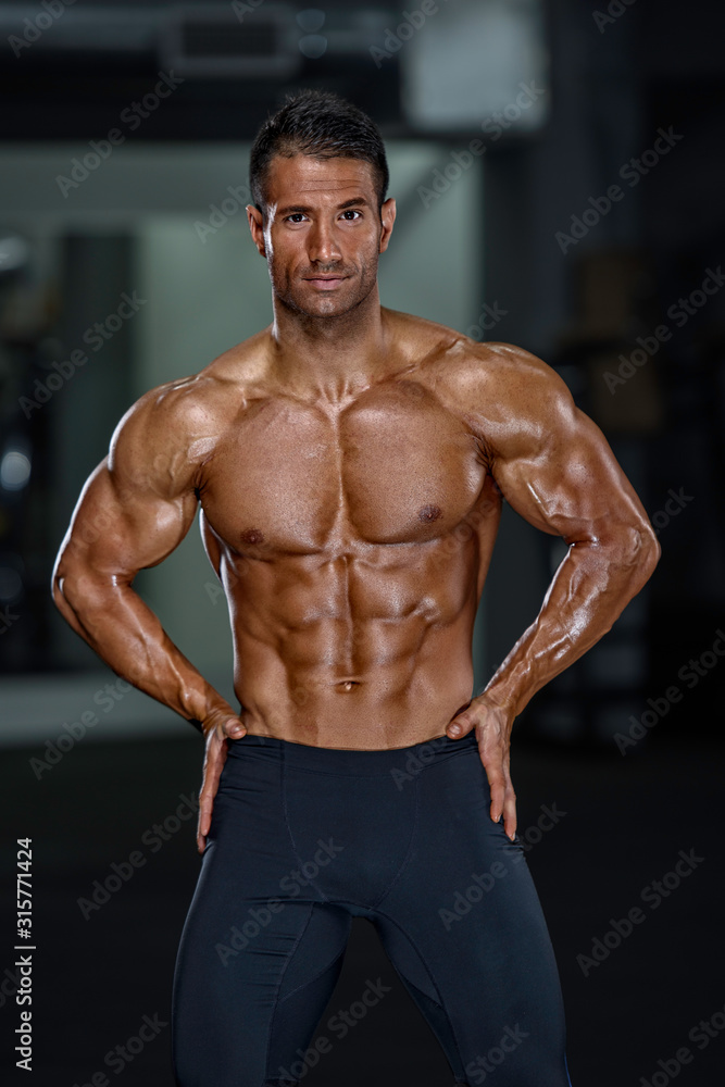Handsome Muscular Men Flexing Muscles at the Gym Stock Photo | Adobe Stock