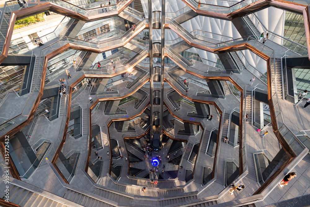 Honeycomb-like structure and elevator within The Vessel in Hudson Yards ...