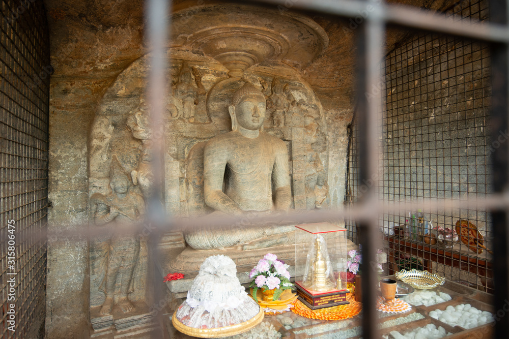 A small statue located inside the artificial cave named the ...