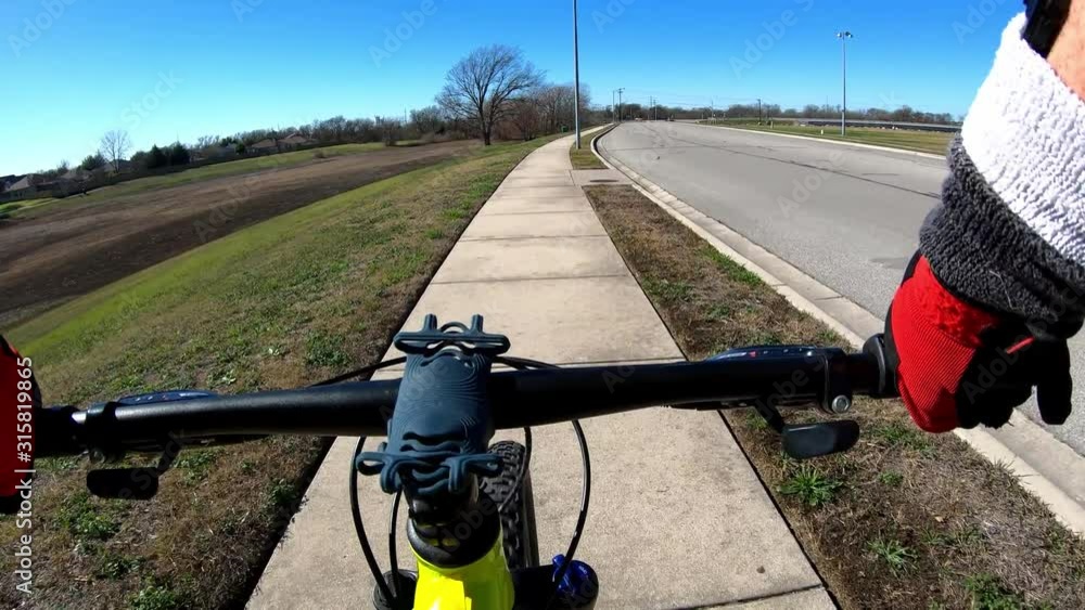Biking Time-Lapse - pedaling down long straight section, dry pond on ...