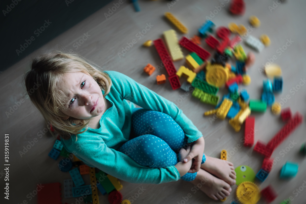 crying little girl with toys at home, kids stress and sadness, child in ...