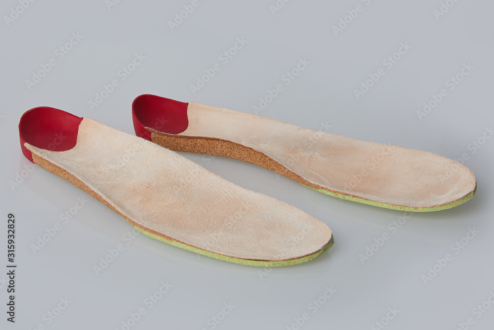 Orthotics on a white background. Insert in shoes to support the foot ...