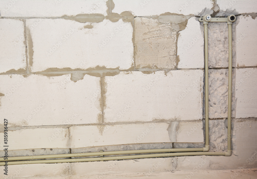 House hot and cold water pipeline installation with connected pipes ...