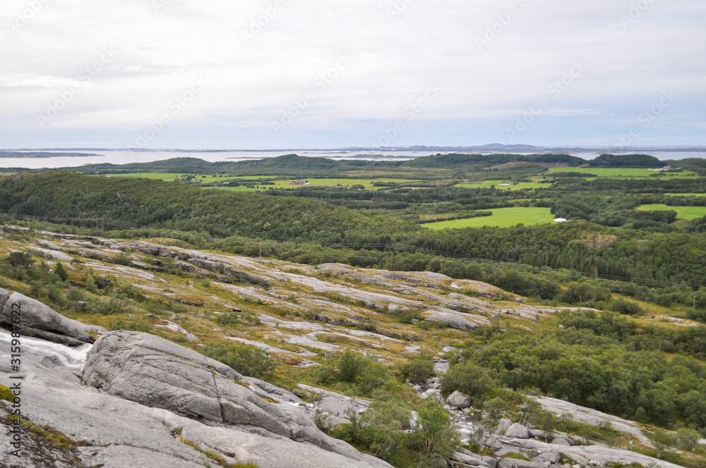 Foto de View to grey granite cliffs of Seven Sister mountains against ...