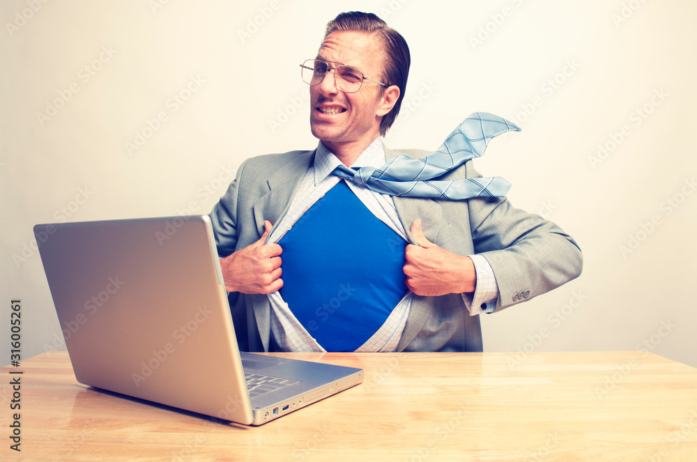 Superhero businessman giving a cheeky wink to the camera as he gets ...