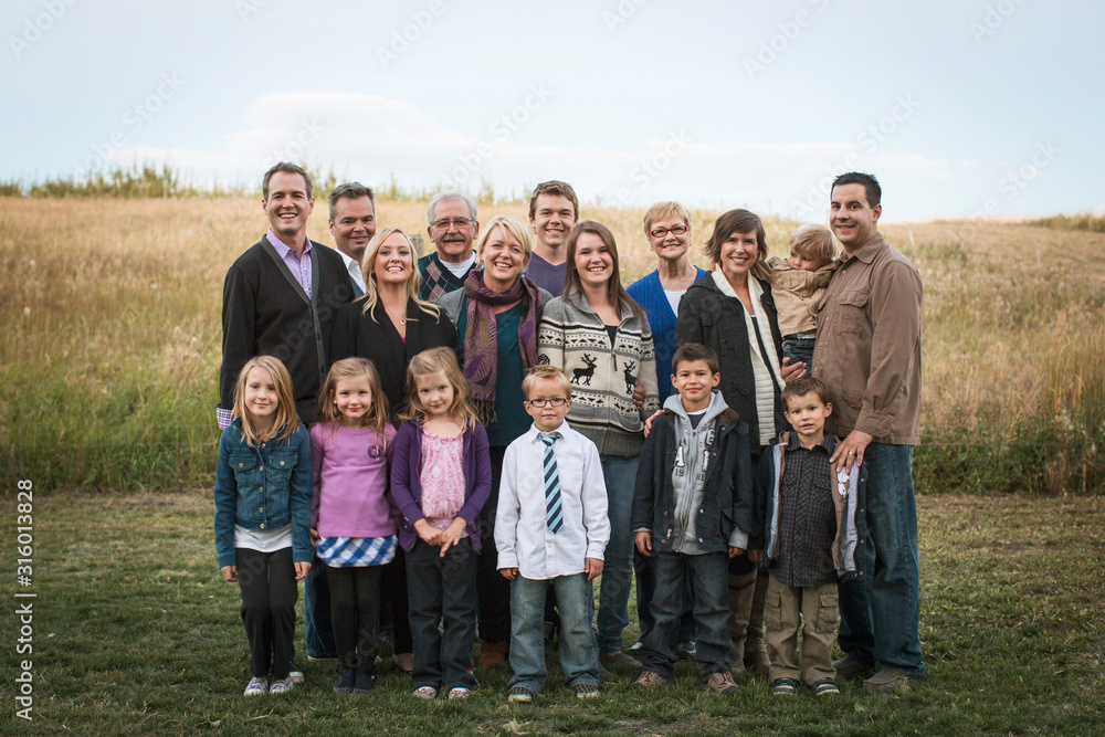 Family portrait of seventeen people standing outdoors Stock Photo ...