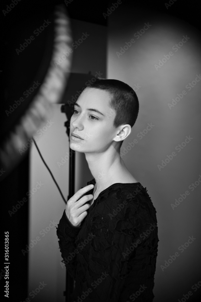 fashion model with short hair posing in studio for portrait head shot ...