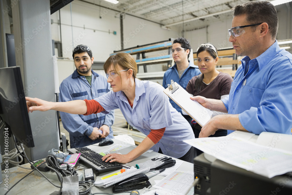 Workers meeting in manufacturing plant Stock Photo | Adobe Stock