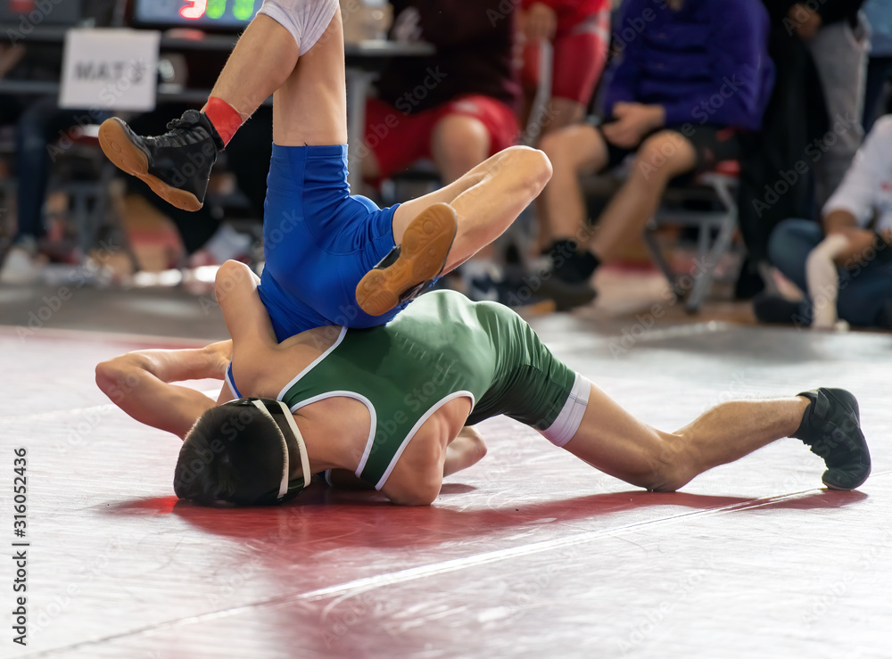 High School wrestlers competing at a wrestling meet Stock Photo | Adobe ...