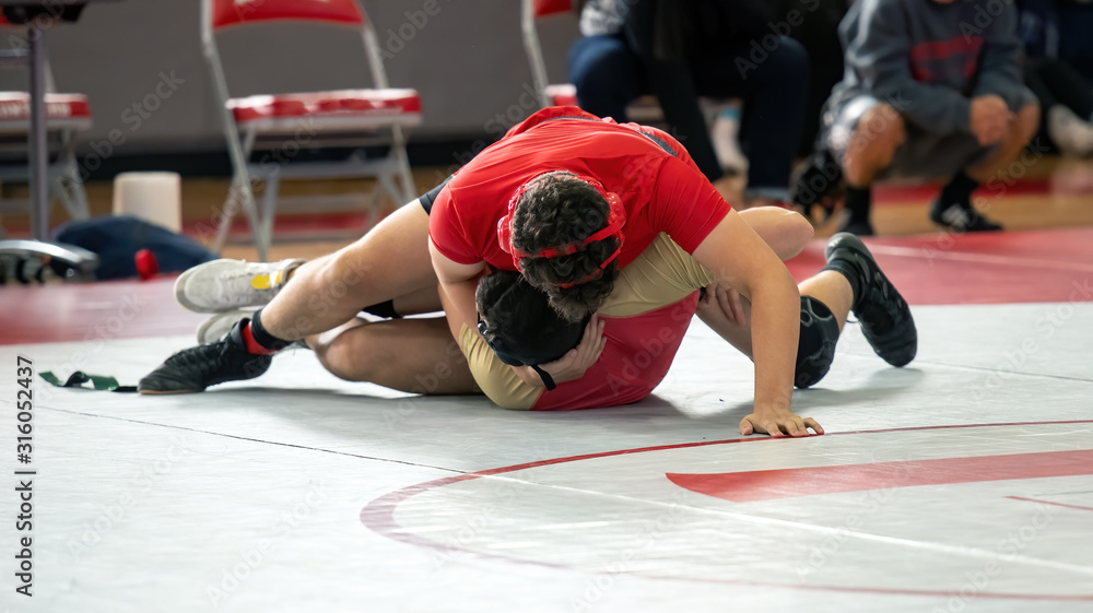 High School wrestlers competing at a wrestling meet Stock Photo | Adobe ...