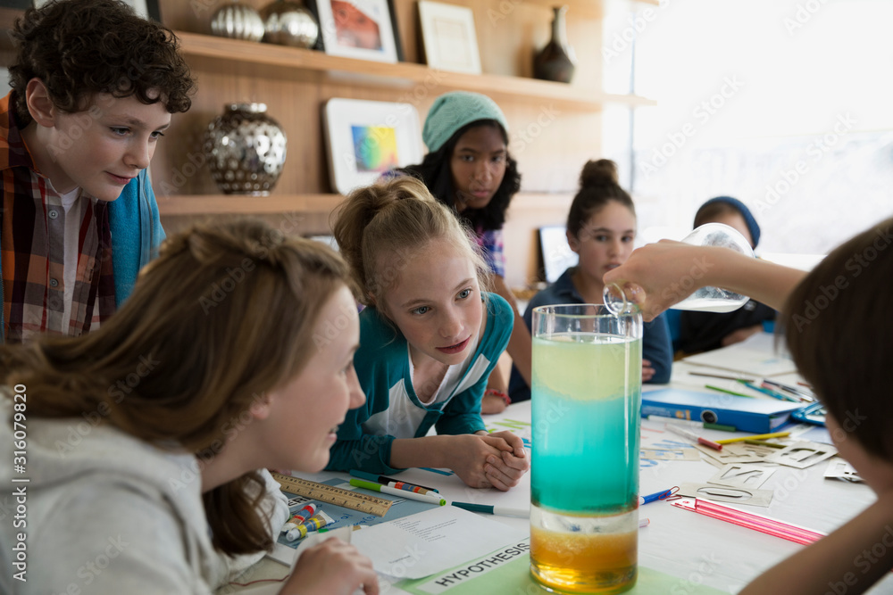 Boys and girls conducting science experiment dining table Stock Photo ...