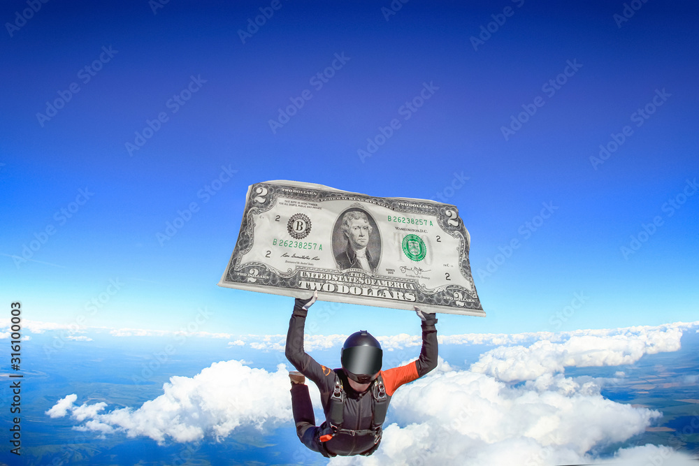 100 dollar. Parachutist is flying a flag of dollar bill. National ...