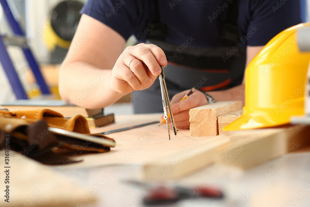 Arms of worker making structure plan on scaled paper closeup. Manual ...