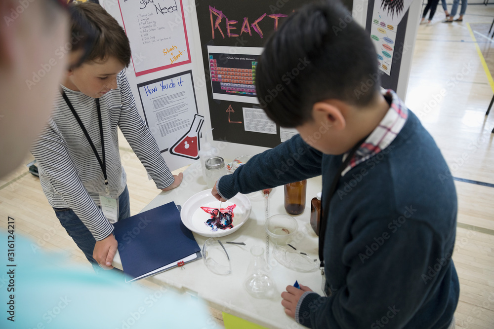 Boy middle school students at interactive science project in science ...