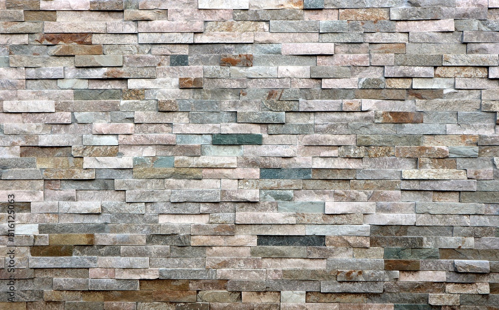 Stone cladding wall made of striped stacked slabs of natural multicolor ...