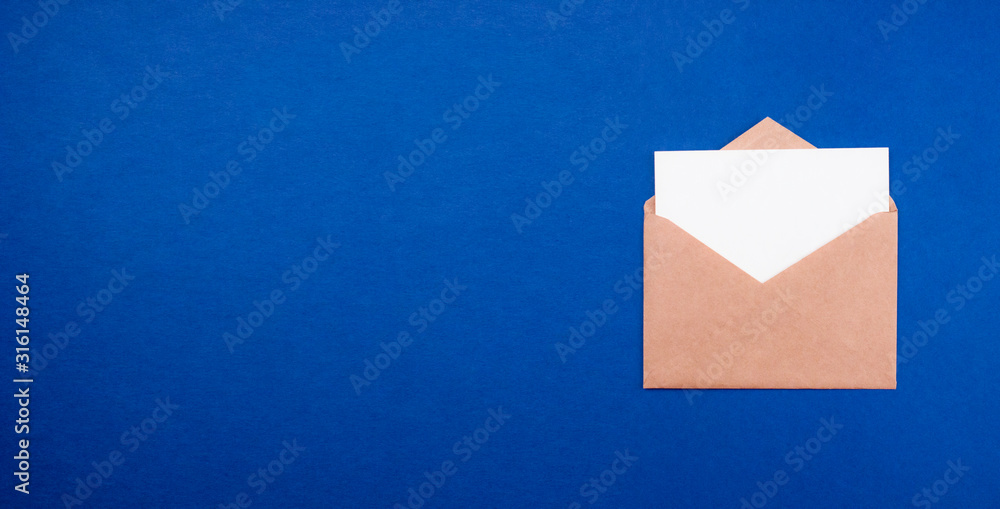 Envelope with white paper sheet letter flat lay on trendy colorful blue ...
