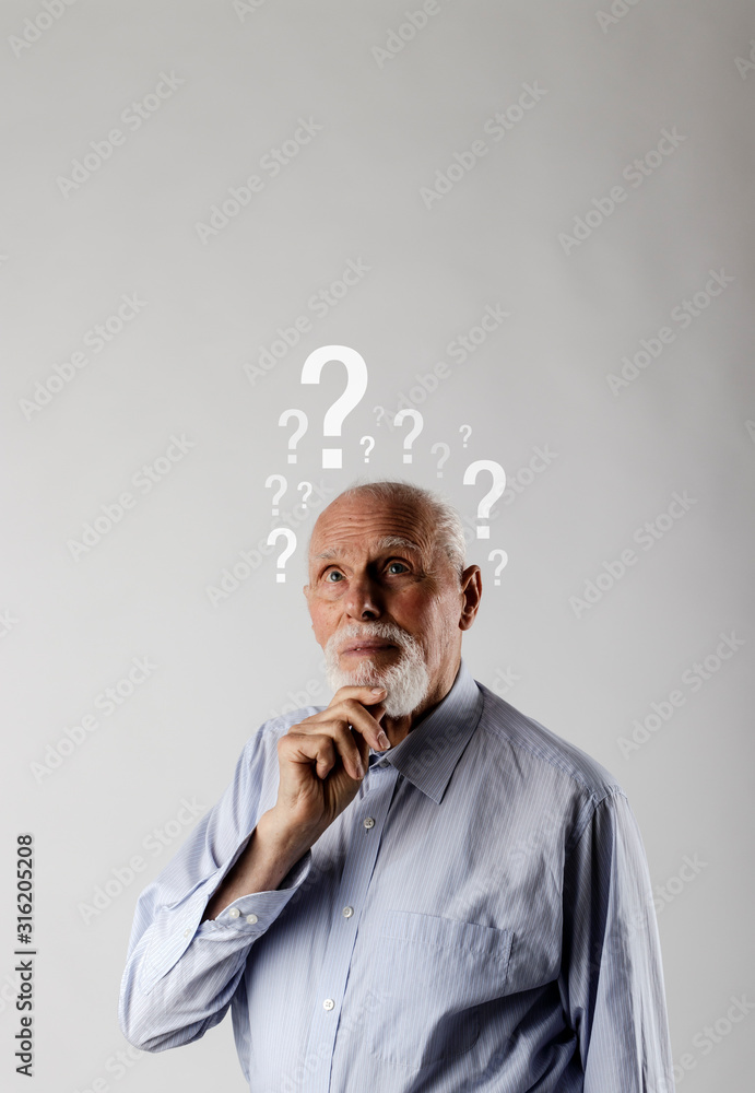 Old man and question marks. Confused old man. Stock Photo | Adobe Stock