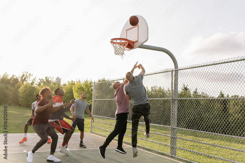 Basketball players scoring goal Stock Photo | Adobe Stock