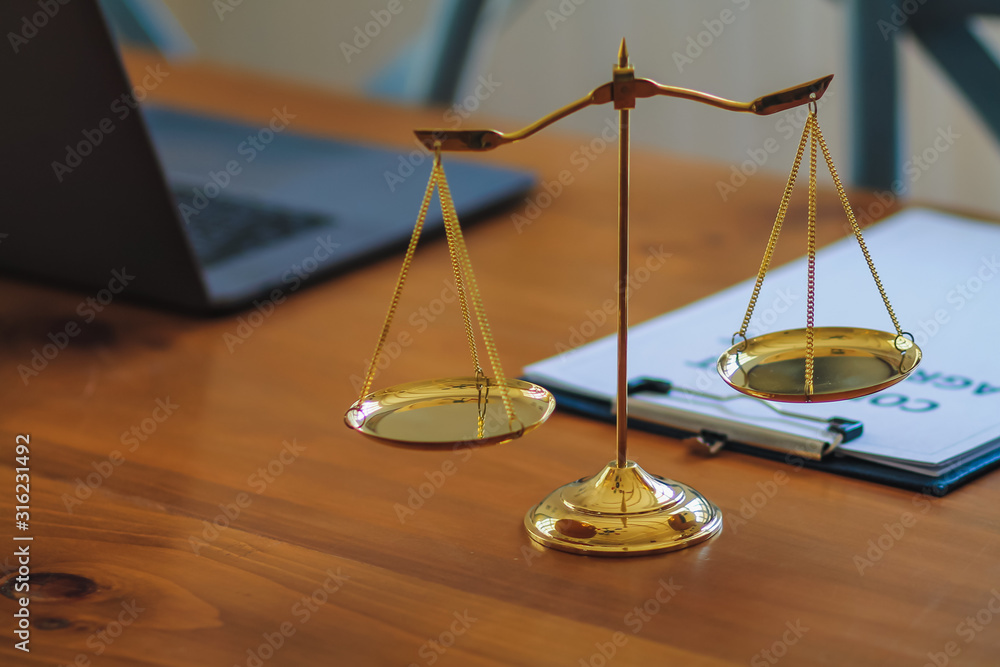 Brass scales are placed on the tables within the lawyer's office for ...