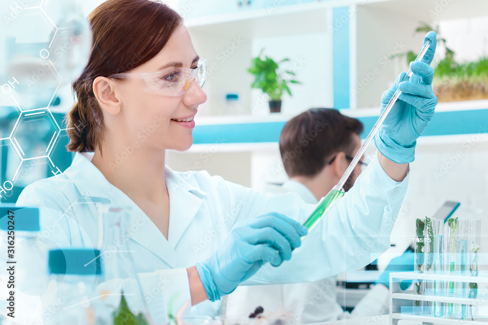 Scientists are working at microbiology laboratory. Woman is conducting ...