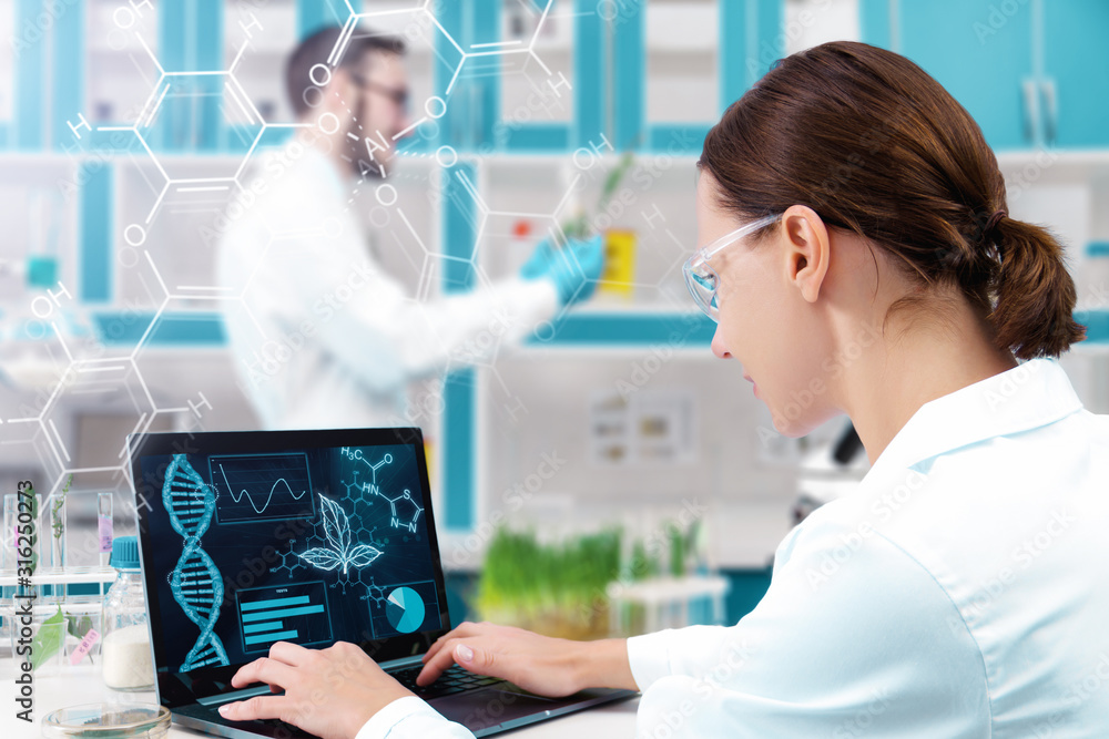 Scientists are working at microbiology laboratory. Woman is conducting ...