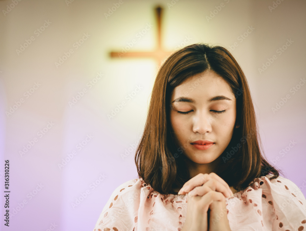 Beautiful asia woman praying inside a church to god blessing to wishing ...
