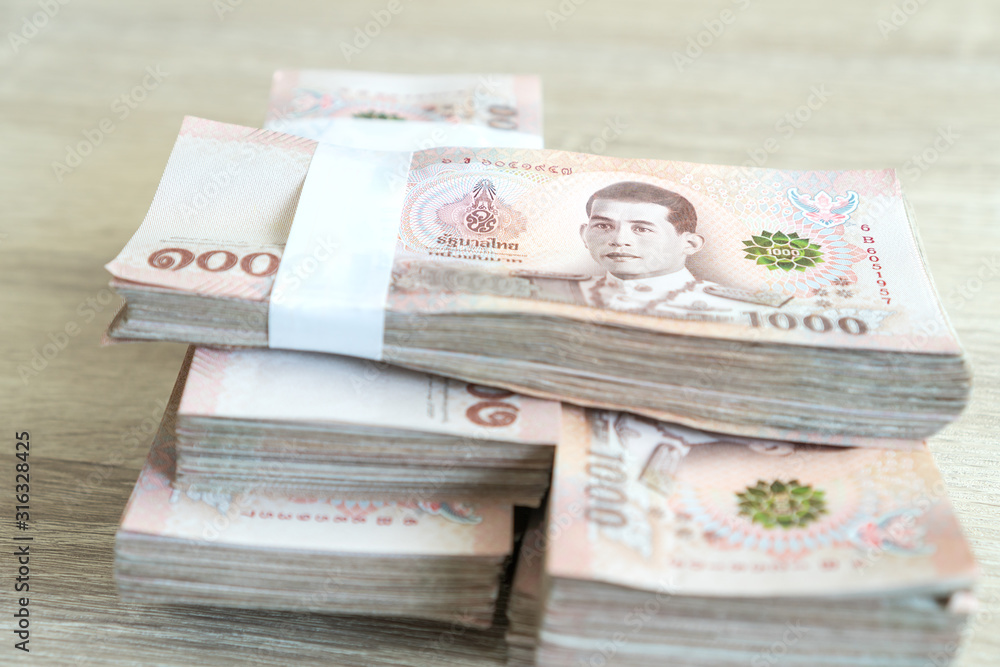 Stack Thai baht banknotes, one thousand baht with tag text in Thai word ...