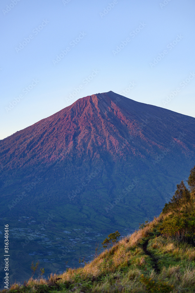 (Selective focus) Stunning view of the Mount Rinjani illuminated by a ...