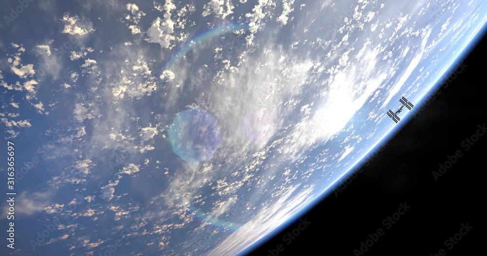 Flight of International Space Station ISS orbiting the blue marble ...