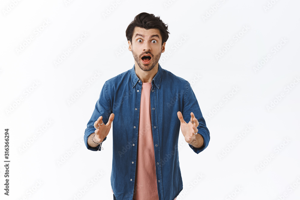 Shocked, concerned intense young man staring at camera, worry something ...