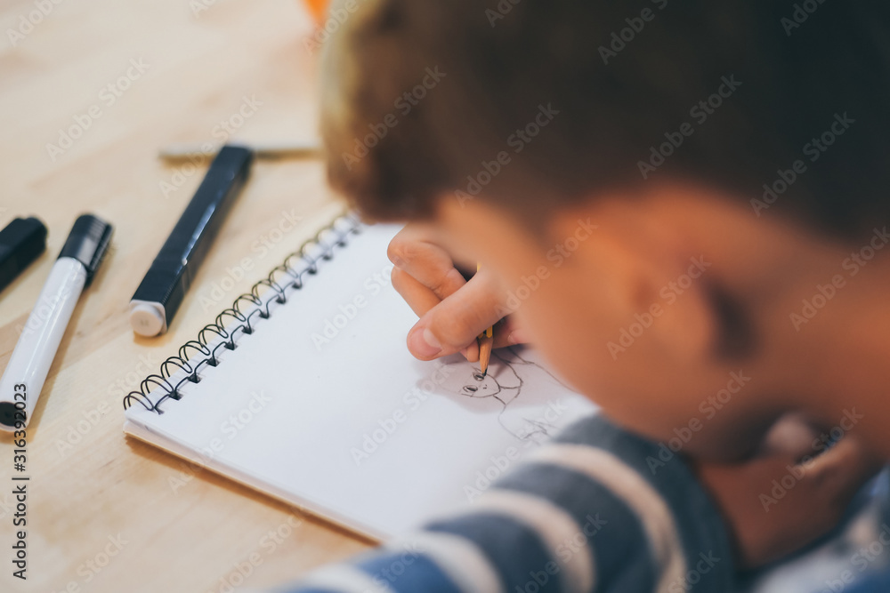 Stockfoto Close up view of student drawing with pencil. Boy doing ...