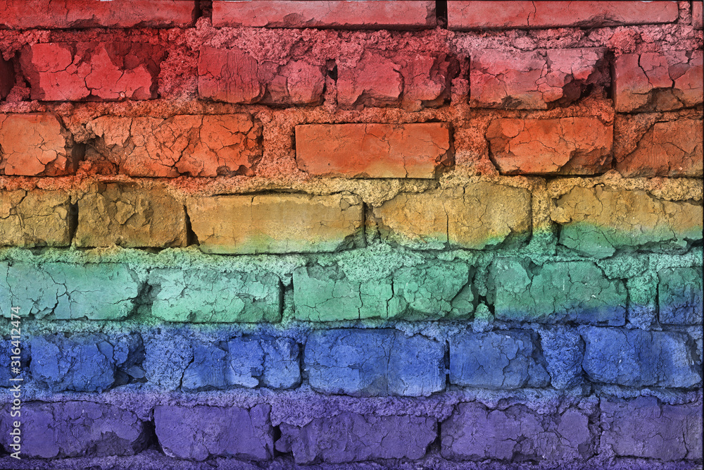 Brick wall painted in the colors of the LGBT flag. Background image ...