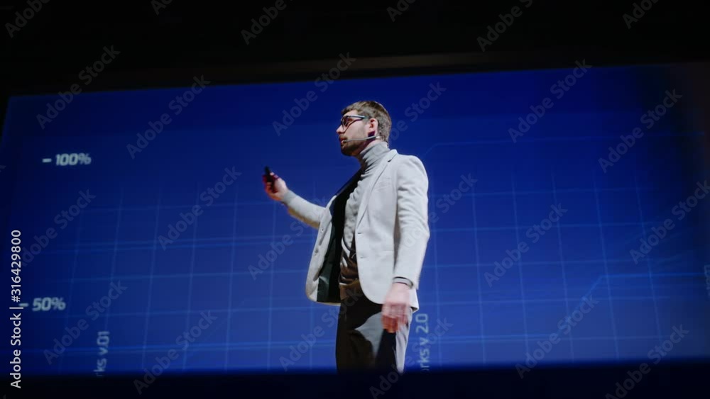 On-Stage Speaker Greets Audience, Presentation of Technological Device ...