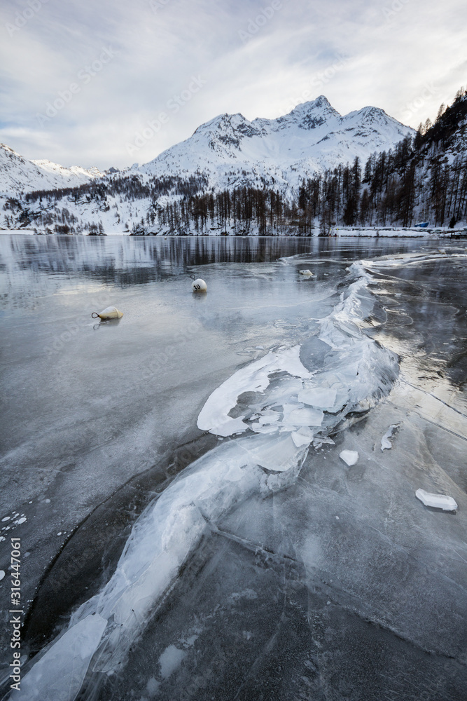 Lakeside with curvy Omiwatari, which is a phenomenon when two ice ...